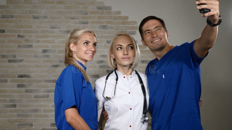 Daily Routine of Doctors. Three Medical Workers Making Selfie Together ...