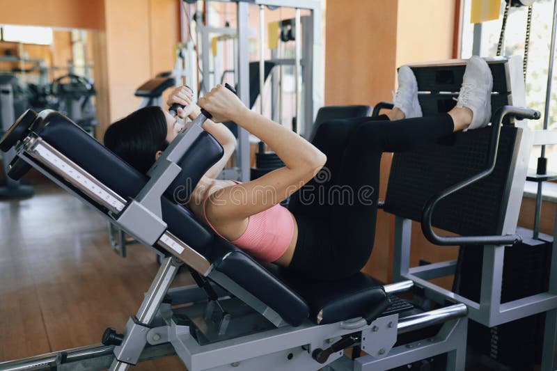 The Routine Exercise of a Woman in the Gym Stock Photo - Image of ...