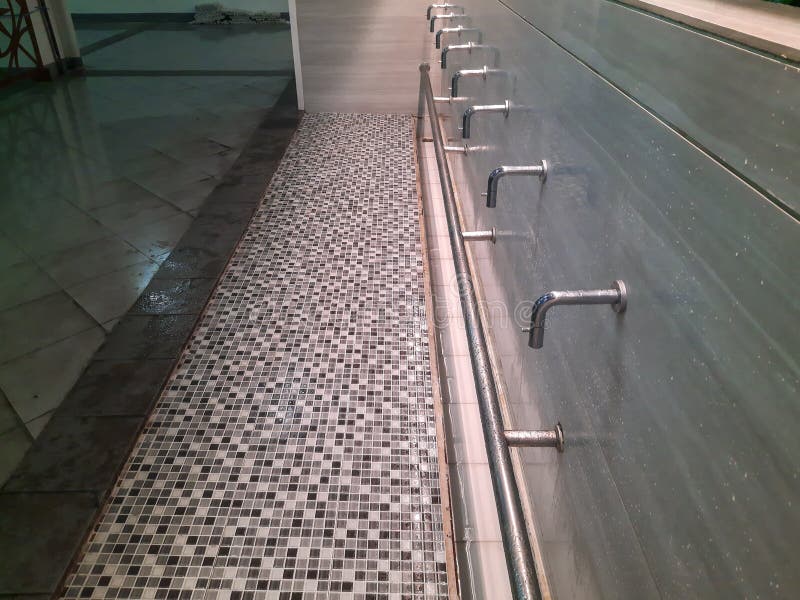 A Row of Ablution Faucets in the Mosque Stock Photo - Image of floor ...