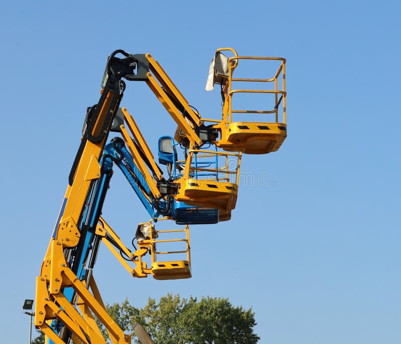 Aerial Working Platforms of Cherry Picker Against Blue Sky with Clouds ...