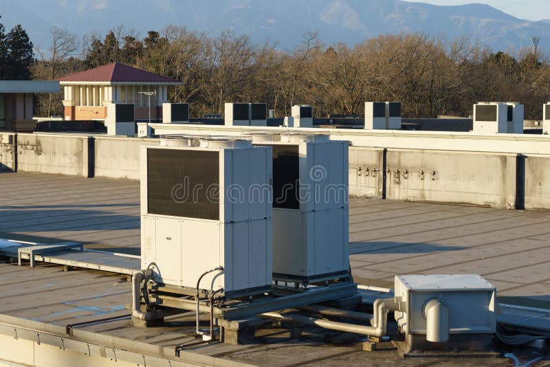 A Row of Air Conditioning Units on a Rooftop. Stock Photo - Image of ...