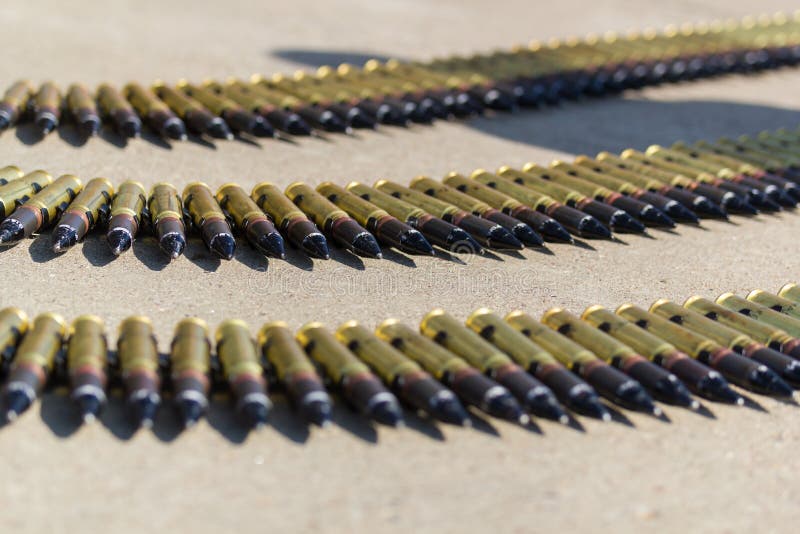 A Row of Ammunition Cartridges - Three Rows of Bullets in the Circle ...
