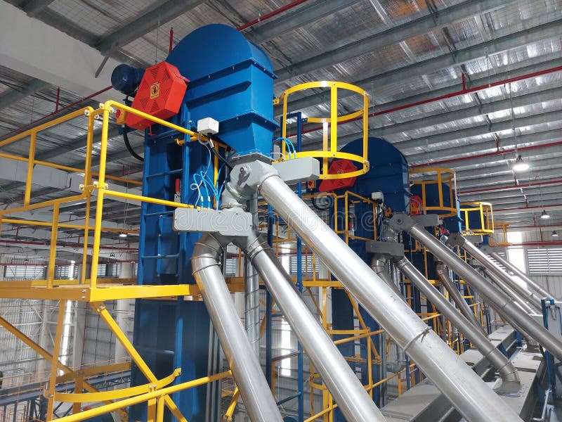 An Row Array of Bucket Elevator in a Rice, Bean, Coffee Factory Stock ...