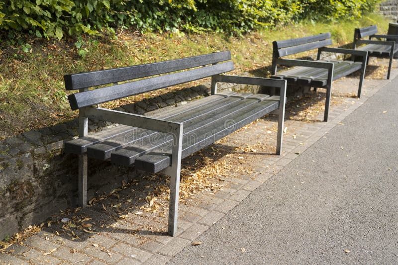 Row of Benches in a Summer Park. Figured Concept Stock Photo - Image of ...