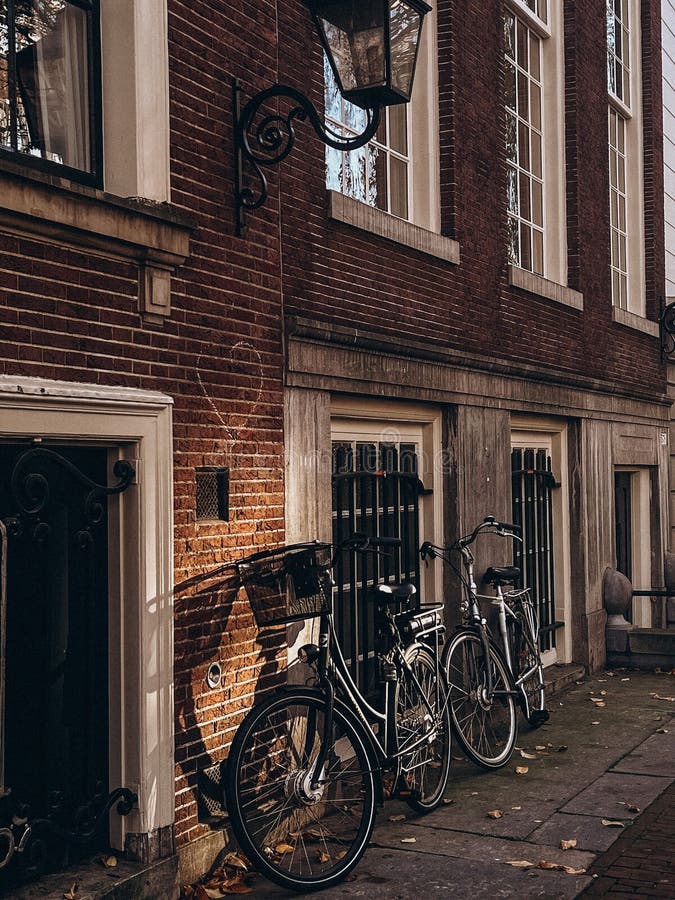 Row of Bicycles Parked Outside of a Brick Building with Multiple ...