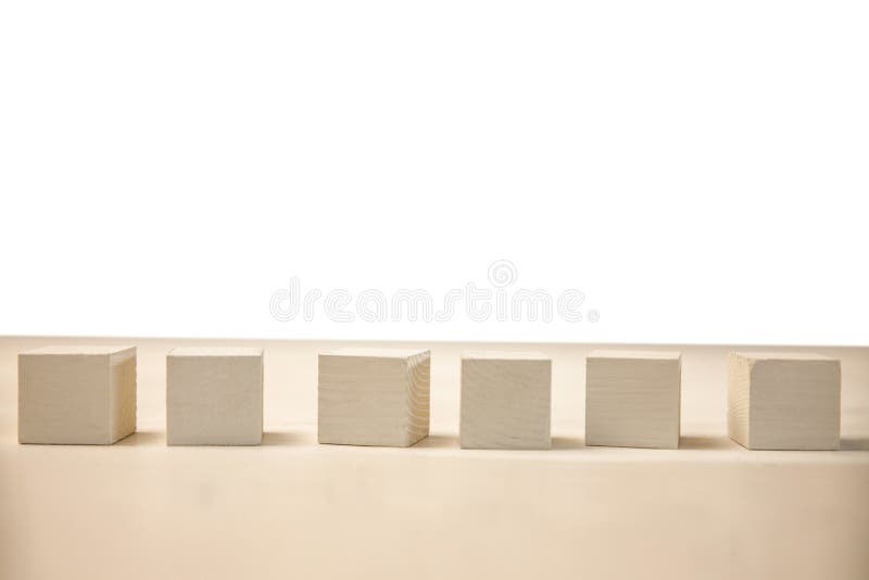 Row of blocks on table stock image. Image of white, block - 62325261