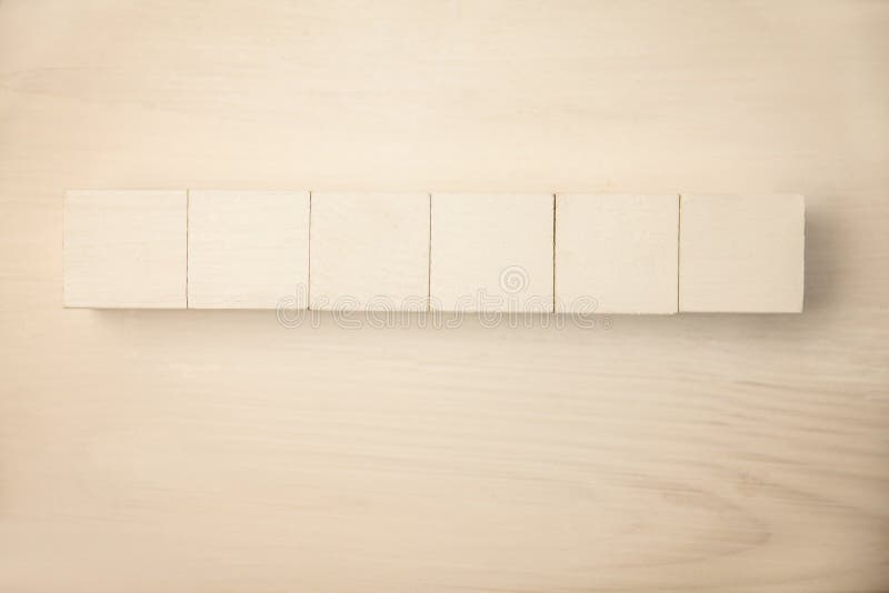 Row of blocks on table stock image. Image of building - 62325279