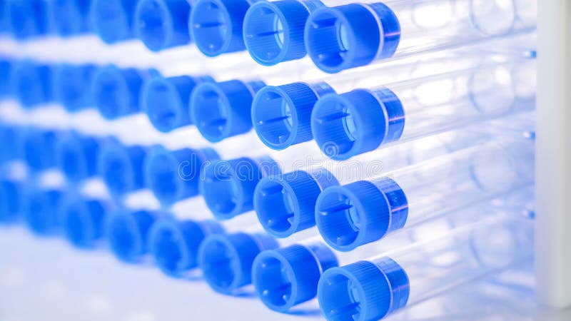 27937_Row_of_the_blue_covered_test_tubes_in_the_laboratory Stock Photo ...