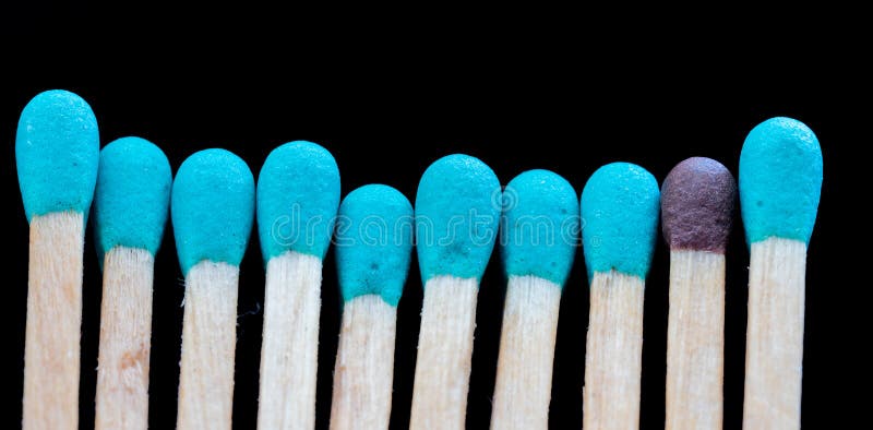 A Row of Blue Matches and One Different on Black Background. Stock ...
