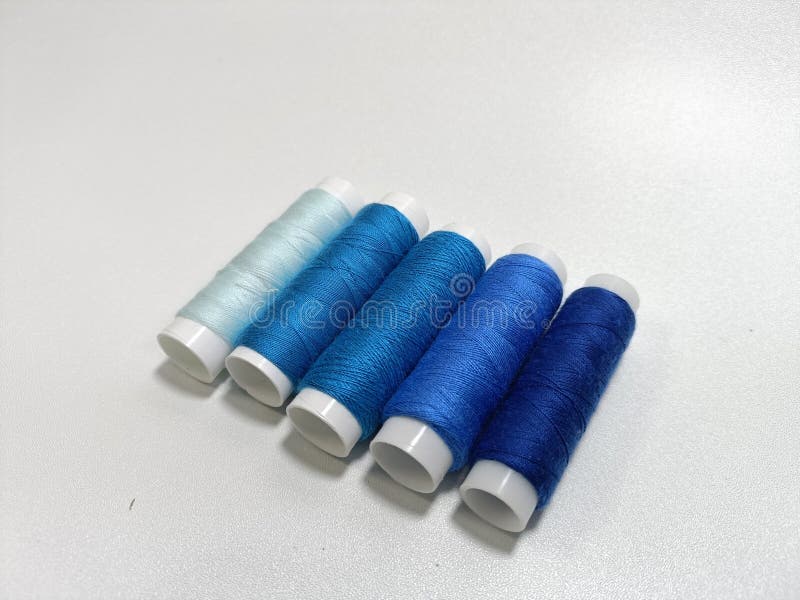 Row Blue Sewing Thread Spools Gradient Shades White Background Stock ...