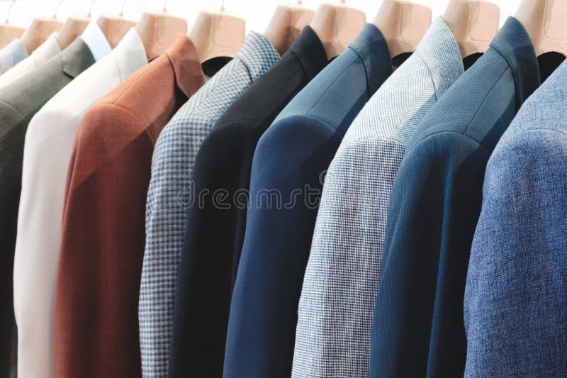 A Row of Blue and White Jackets Hang on a Rack. Stock Image - Image of ...