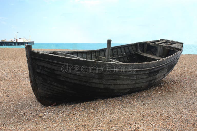 Row boat on the beach stock image. Image of beached, sand - 13235611