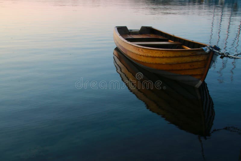 Row boat in calm water stock photo. Image of floating - 46014152