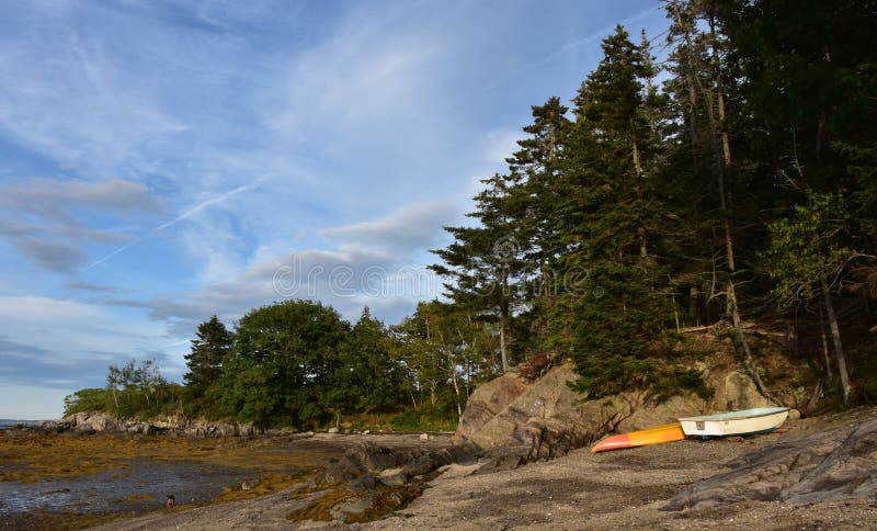 Row Boat and a Kayak on a Deserted Beach Stock Image - Image of ...