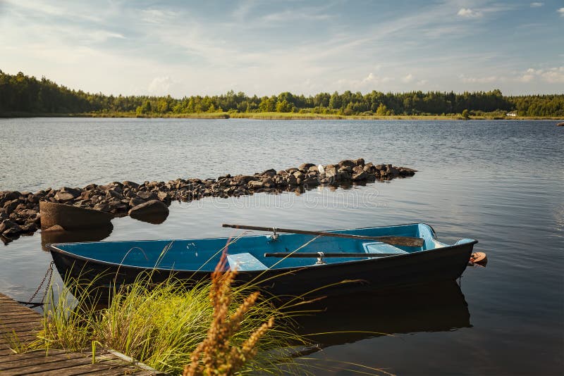 Row boat by lake stock photo. Image of pond, afternoon - 78666380