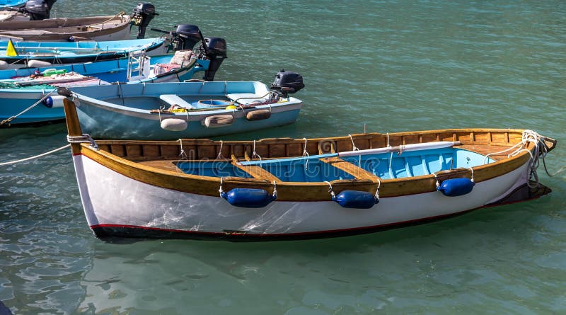 Row boat stock photo. Image of water, brown, nature - 115329082