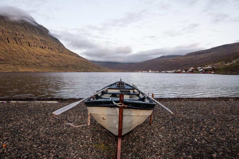 Boat on the Shore of a Misty Lake Stock Photo - Image of calm, nature ...