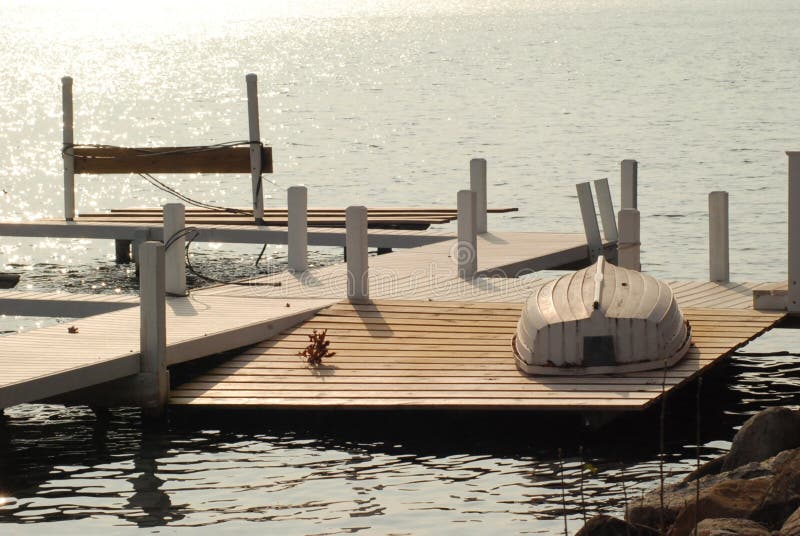 A Row Boat Up Side Down on a Lake Dock Stock Photo - Image of ...