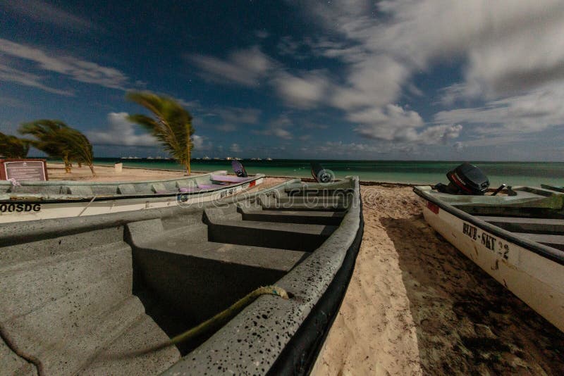 A Row of Boats are Sitting on the Beach at Night Stock Photo - Image of ...