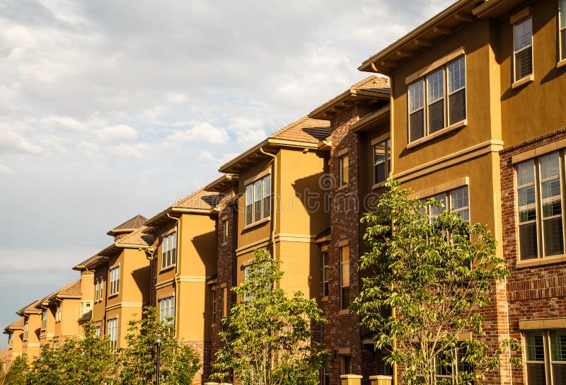 Row of Brick Condos with Bay Windows Stock Photo - Image of expensive ...
