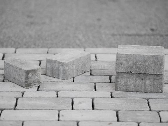 Row of Bricks are Laying on a Gray Sidewalk Stock Photo - Image of path ...