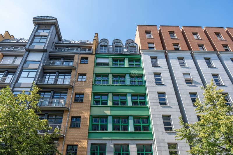 Row of Buildings with a Green Building in the Middle Stock Image ...