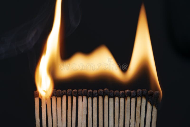 A Row of Burning Matches on a Black Background. the Flame Moves from ...