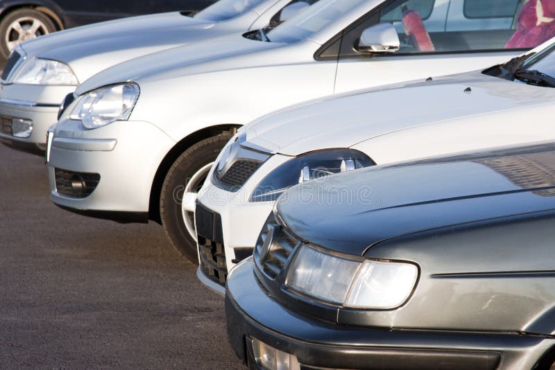 Cars parked in a row stock image. Image of road, motor - 5674919