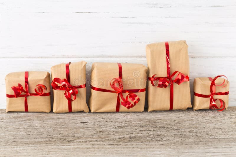 Row of Christmas Presents on a Table Stock Photo - Image of homemade ...