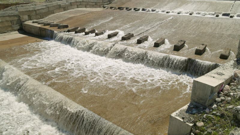 Row of Chute Dentate Blocks in Concrete Water Spillway Channel Slope ...