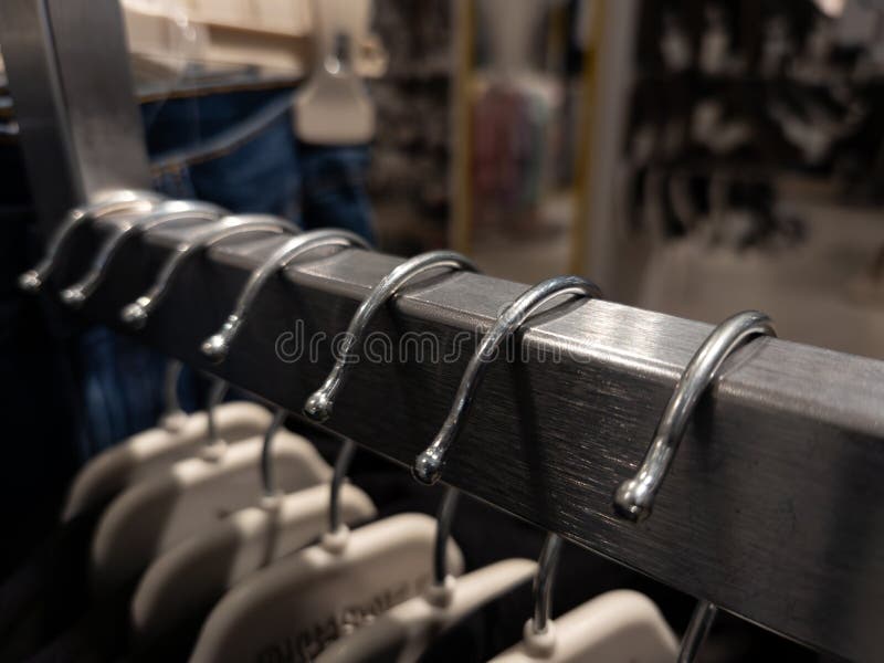 A Row of Clothes Hanging on a Rack in a Clothing Store Stock Photo ...