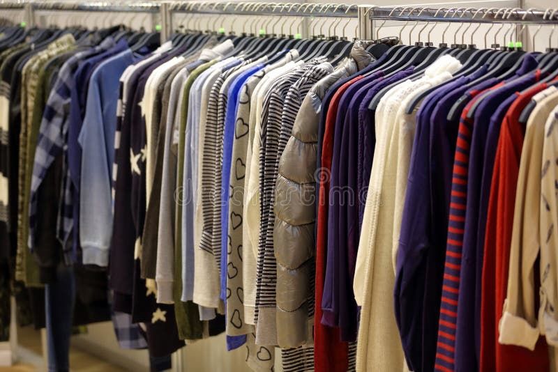 Row of Clothes Hanging in Wardrobe or Store Stock Photo - Image of ...
