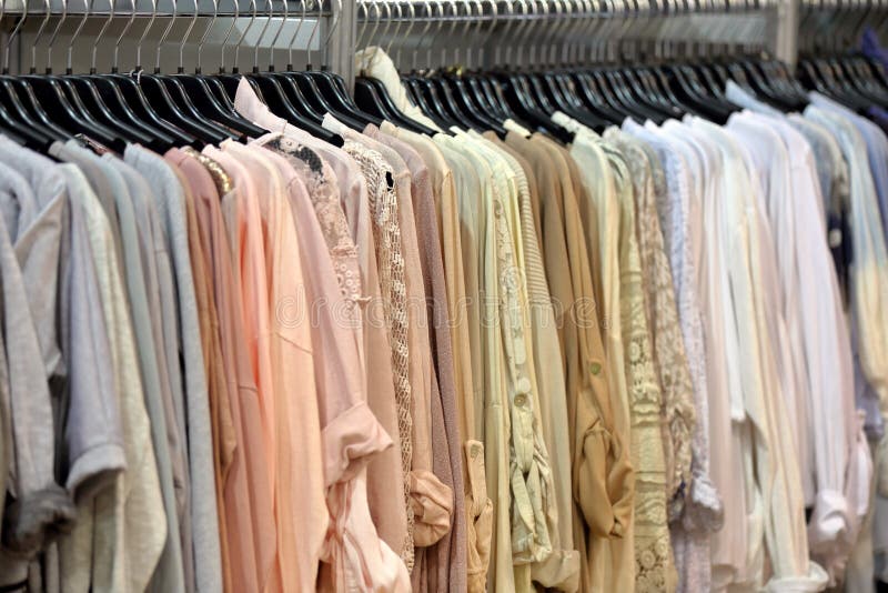 Row of Clothes Hanging in Wardrobe or Store Stock Photo - Image of ...