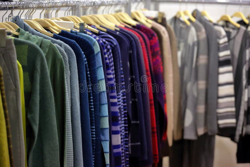 Row of Clothes Hanging in Wardrobe or Store Stock Photo - Image of ...