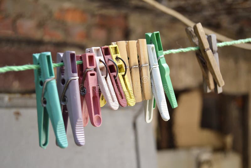 Row of Clothes Pins on a Plastic String Stock Image - Image of ...