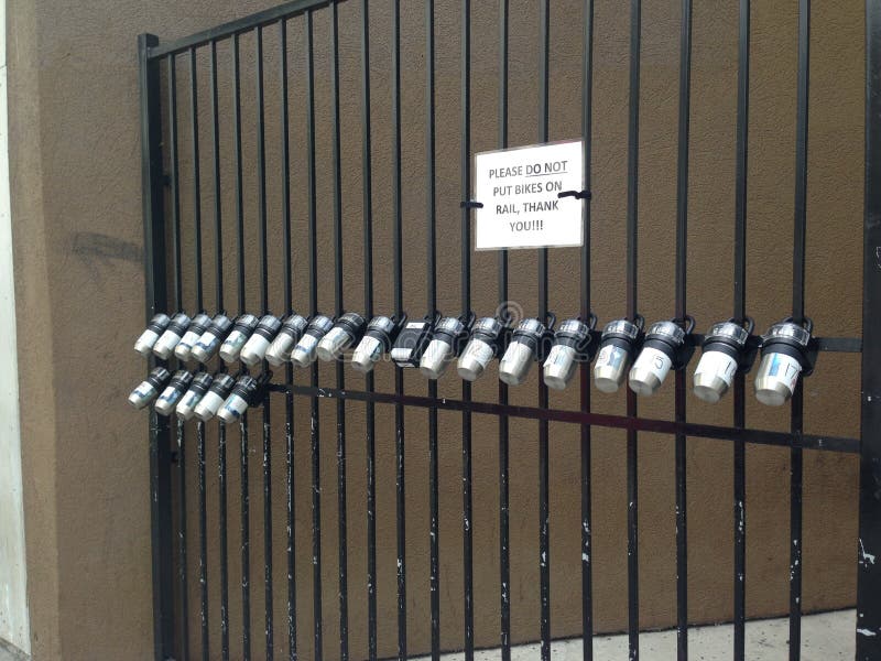 A Row of Key Boxes on an Iron Fence Stock Image - Image of boxes ...