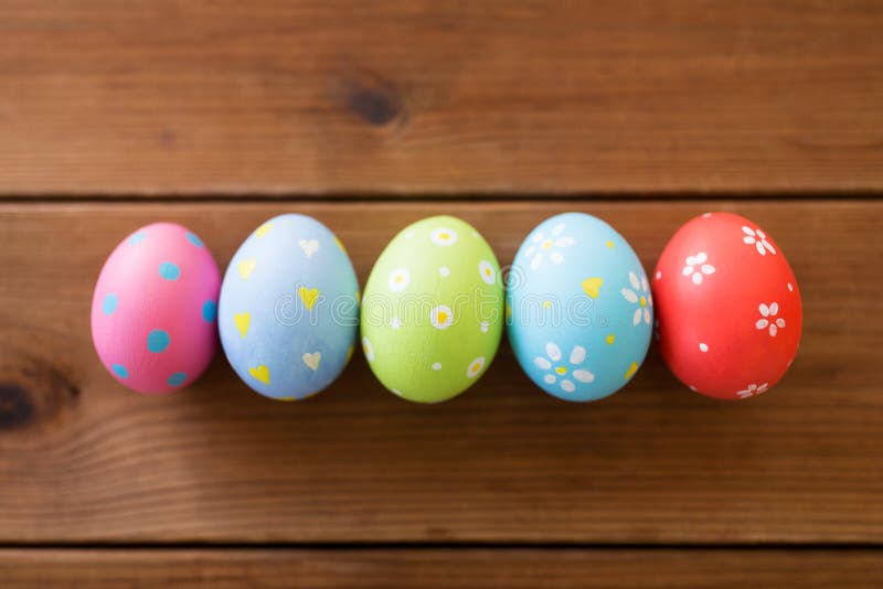 Row of Colored Easter Eggs on Wooden Table Stock Photo - Image of ...