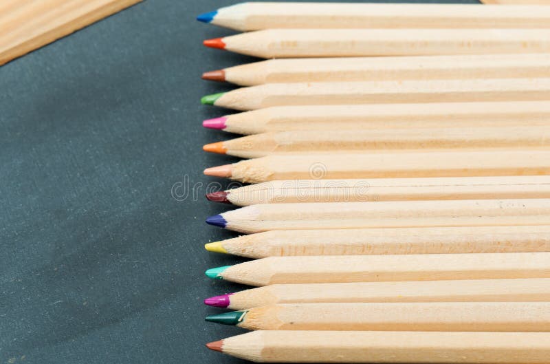 Row of colored pencil stock photo. Image of color, objects - 83881148