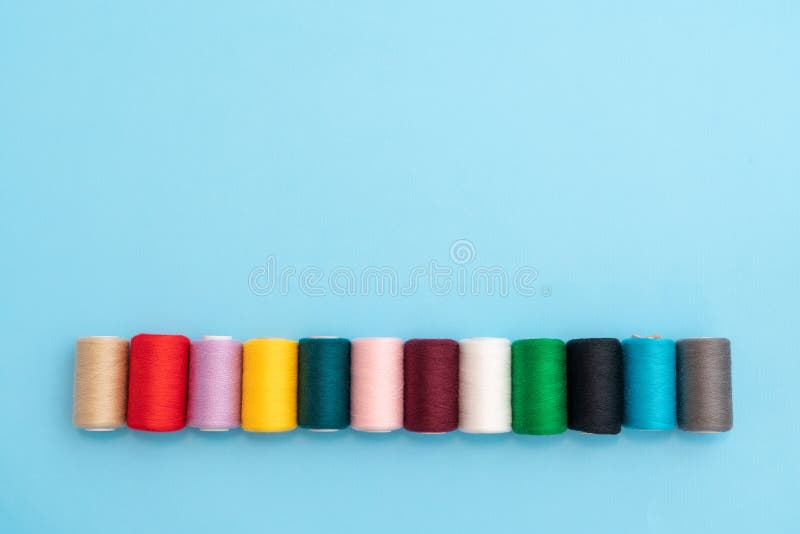 Row of Colored Spools with Sewing Threads Close Up and Place for ...