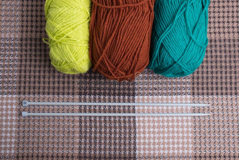 Row of Balls of Wool with a Set of Knitting Needles. Stock Image ...