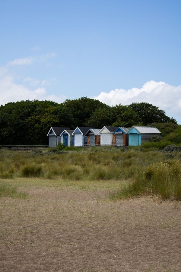 Row of Colorful Beach Huts on a Sandy Beach Editorial Image - Image of ...