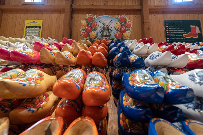 A Row of Colorful Clogs are Displayed in a Store Stock Image - Image of ...