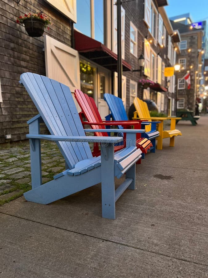 Row of Colorful Outdoor Chairs Along a Sidewalk Editorial Image - Image ... Row of Colorful Outdoor Chairs Along a Sidewalk Editorial Image - Image ...