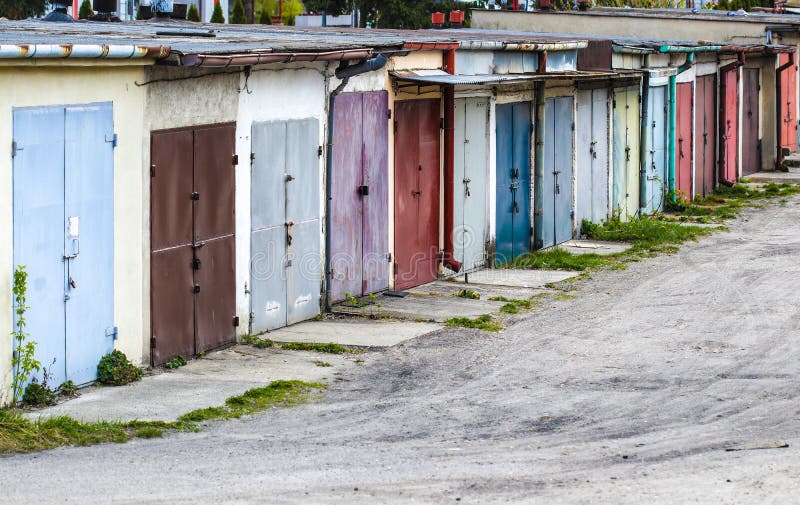 Row of colourful garages stock image. Image of buildings - 220391341