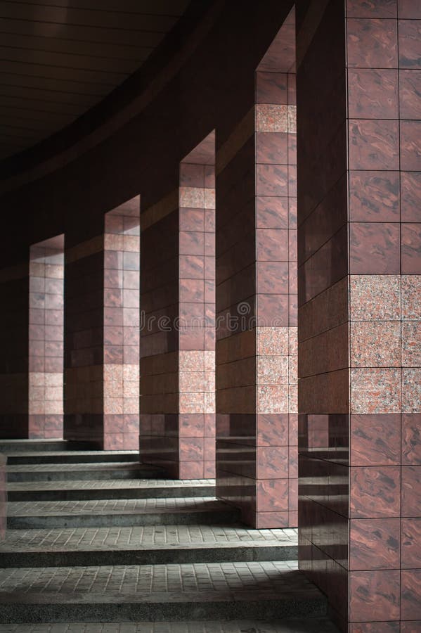Row of Columns with Sunlight in the Gaps and Reflected in Shiny Stock ...