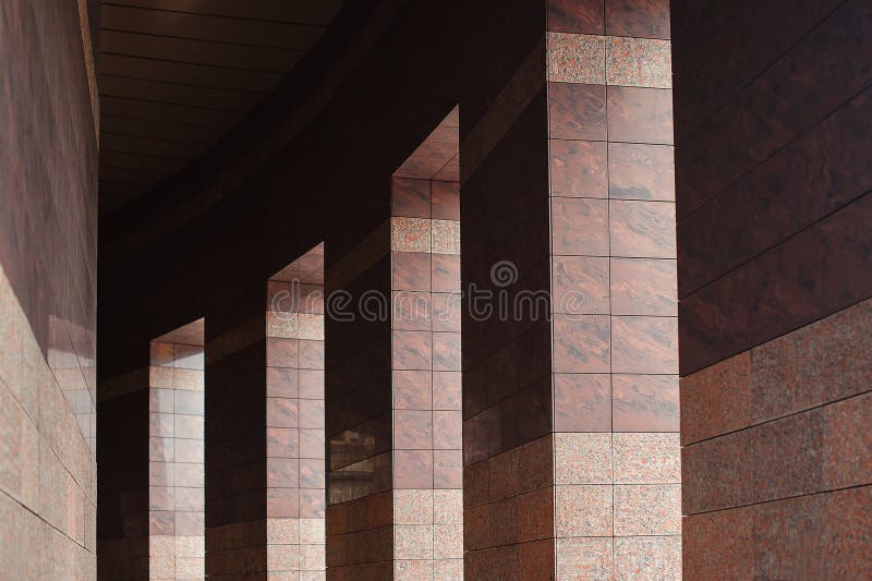 Row of Columns with Sunlight in the Gaps and Reflected in Shiny Stock ...