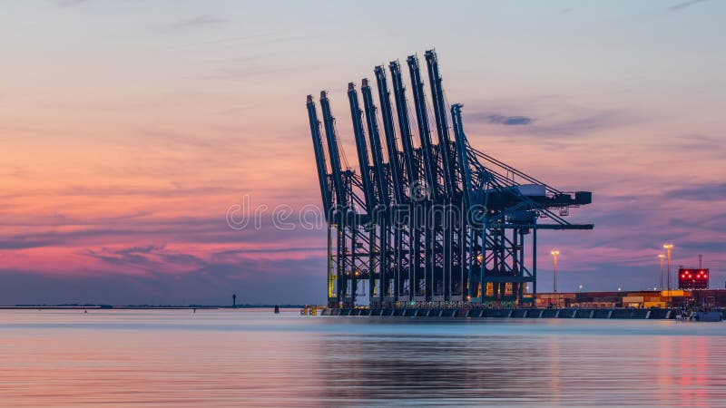 Row of Container Terminal Cranes at Red Colored Sunset, Port of Antwerp ... Row of Container Terminal Cranes at Red Colored Sunset, Port of Antwerp ...