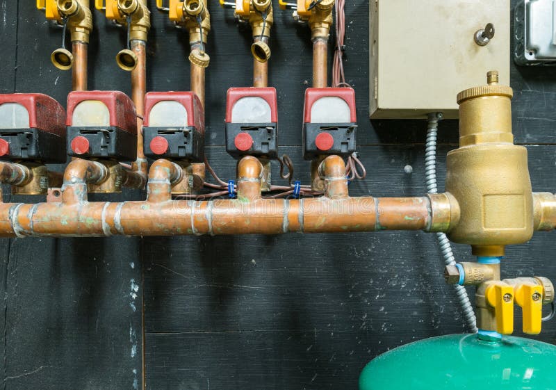 Row of Copper Pipes with Control Unit Stock Photo - Image of control ...