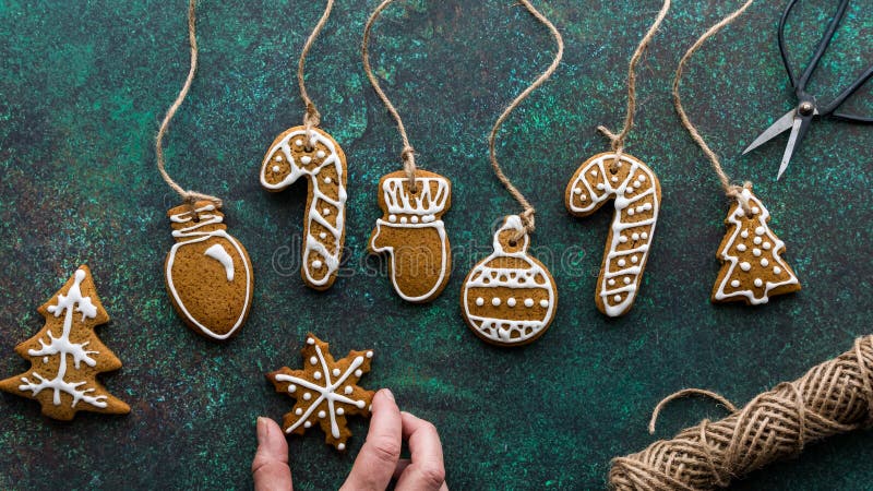 A Row of Decorated Gingerbread Cookie Ornaments with Twine. Stock Photo ...