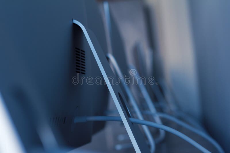 Row of Desktop Computers with Cables on Desk Stock Image - Image of ...